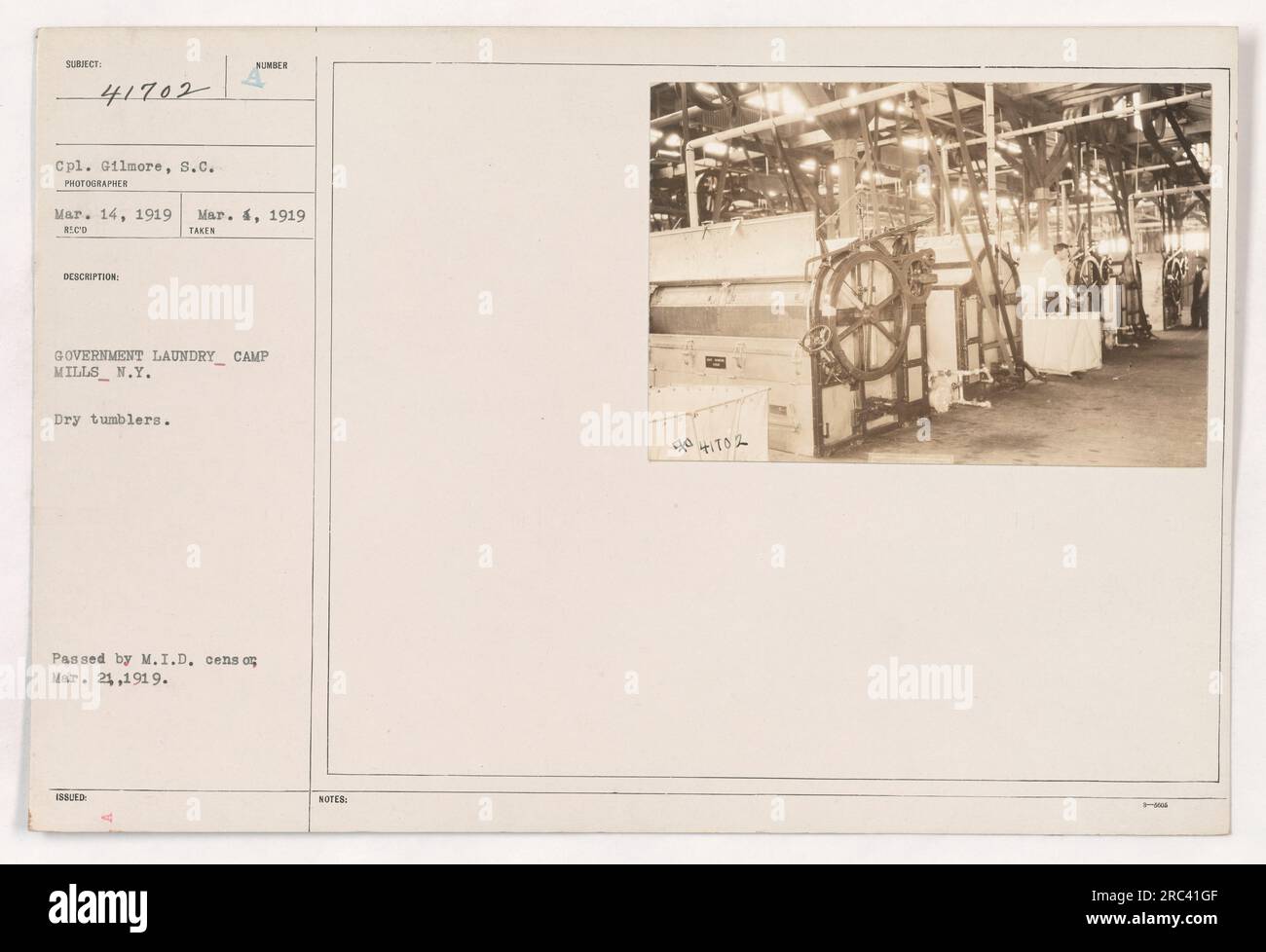 Soldier Cpl. Gilmore operates dry tumblers at the Government Laundry ...