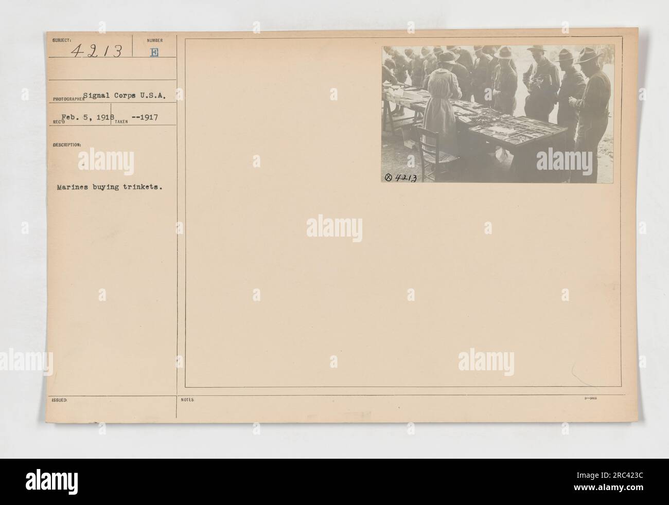 Marines purchasing trinkets during World War One. The photograph was ...