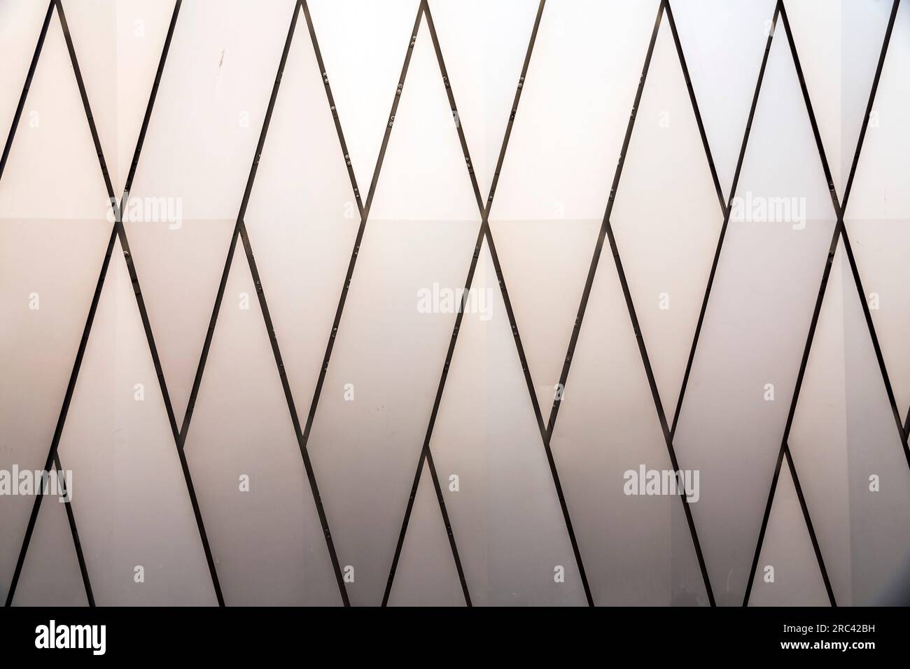 Close up detail from a modern building facade with geometric rhombus ...