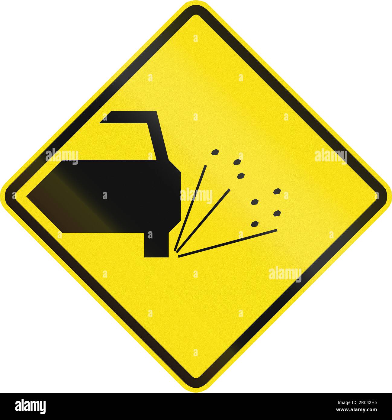 Warning road sign in Chile: Loose chippings Stock Photo - Alamy