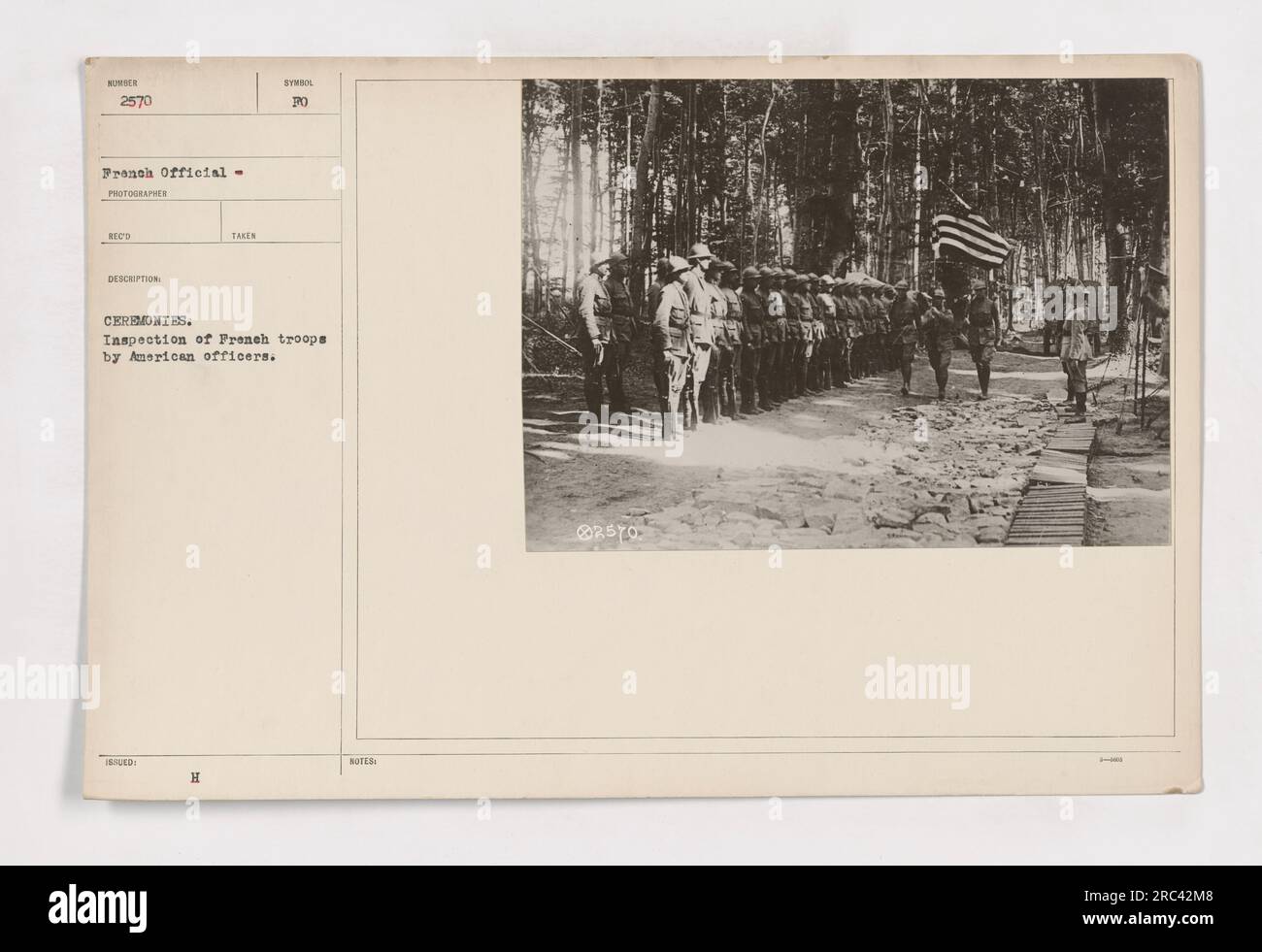American officers inspecting French troops during a ceremony. The ...