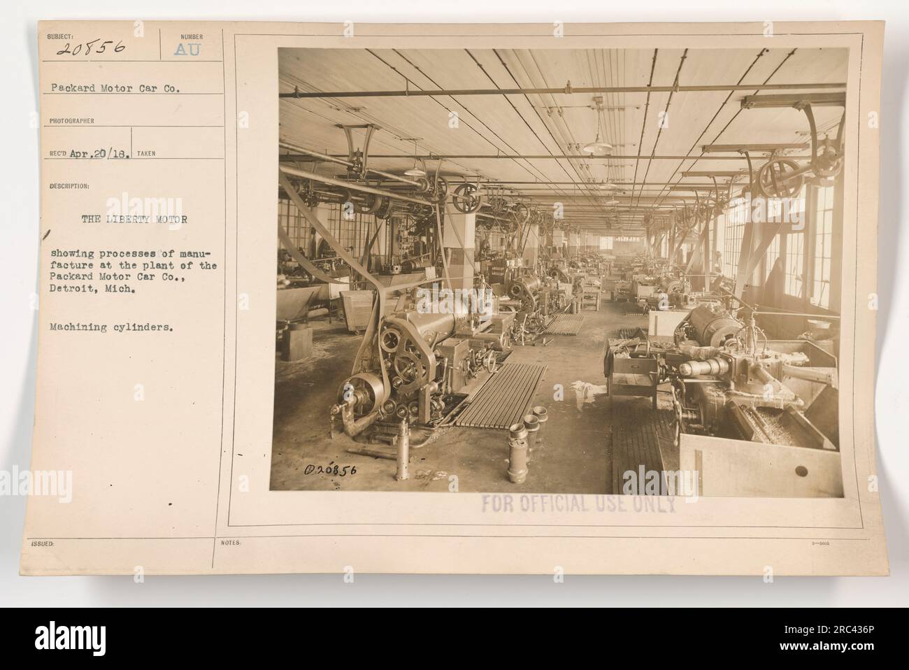 A worker at the Packard Motor Car Co. in Detroit, Michigan, machines ...