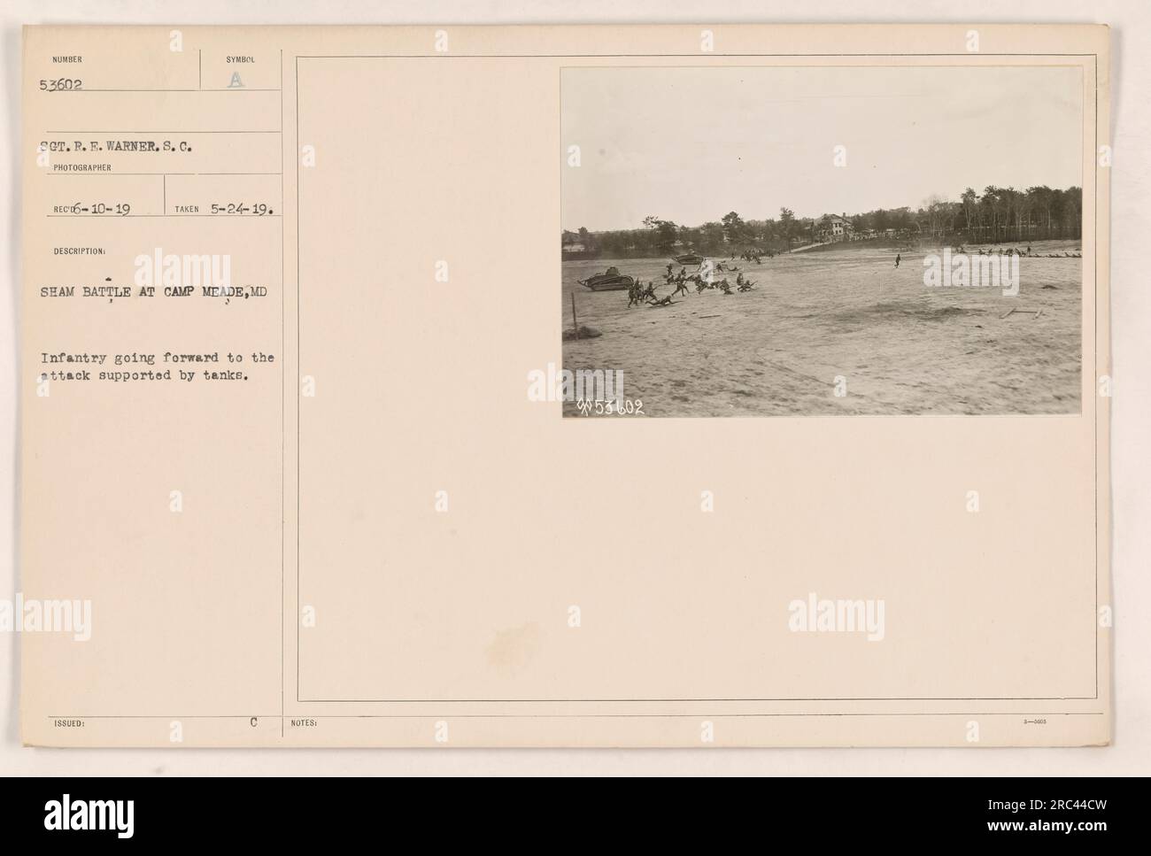 Infantry soldiers advancing with tank support during a sham battle at ...