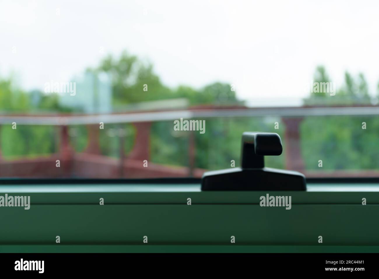 A window handle, used to lock, open, or close a window Stock Photo - Alamy