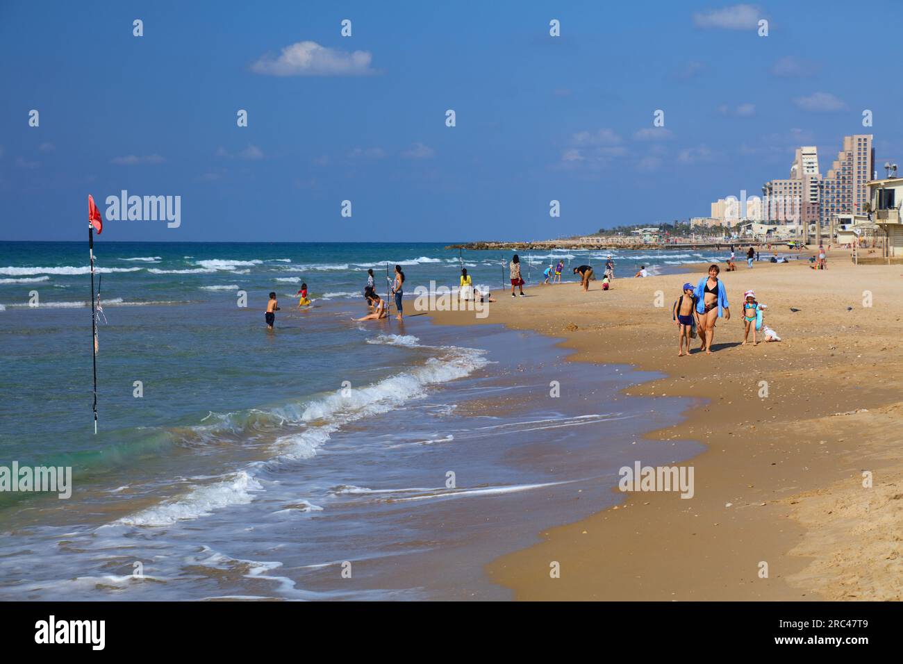 HAIFA, ISRAEL - NOVEMBER 1, 2022: People visit sandy Dado Beach in ...
