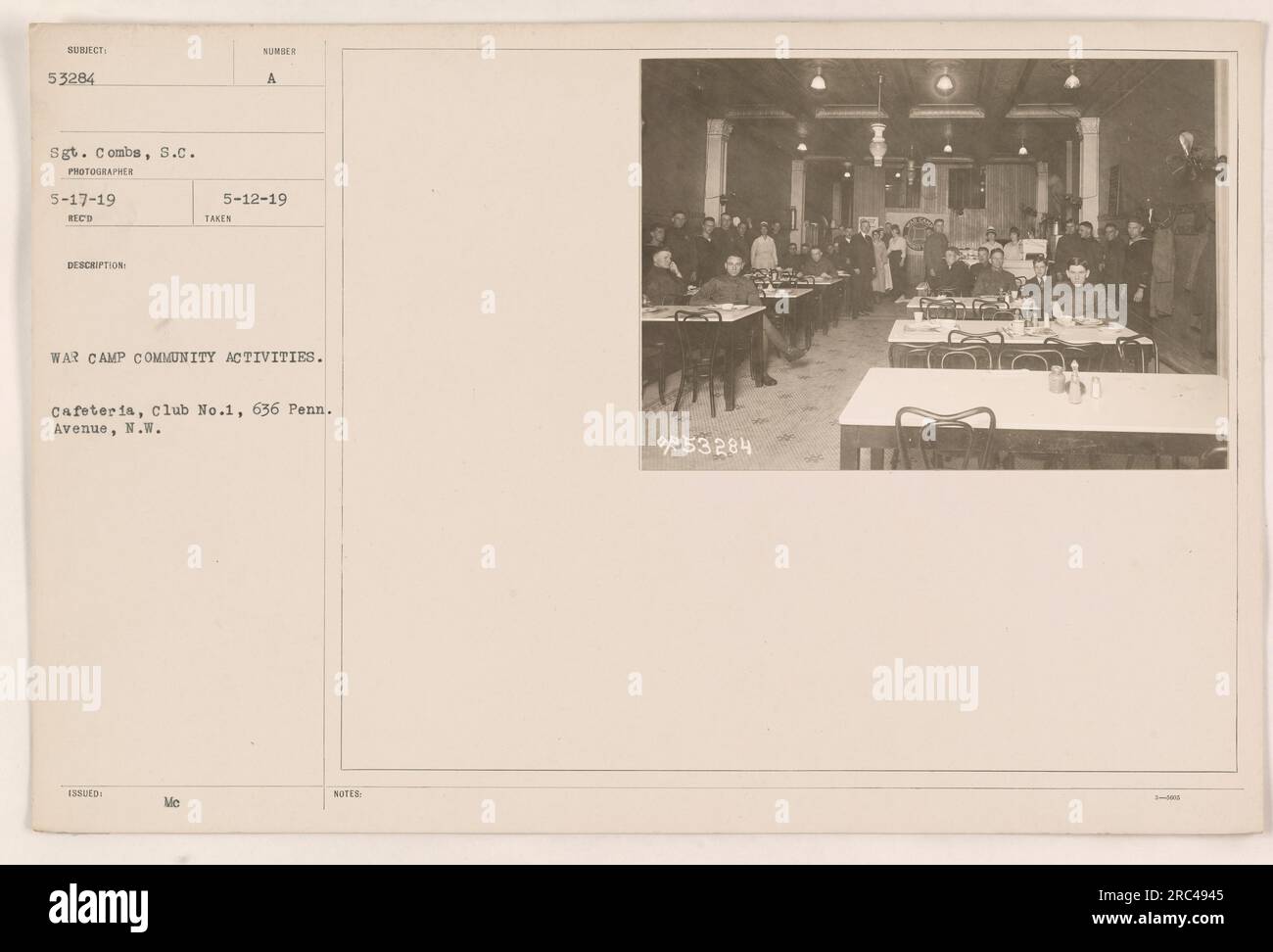 Group of soldiers enjoying a meal at the cafeteria inside War Camp ...