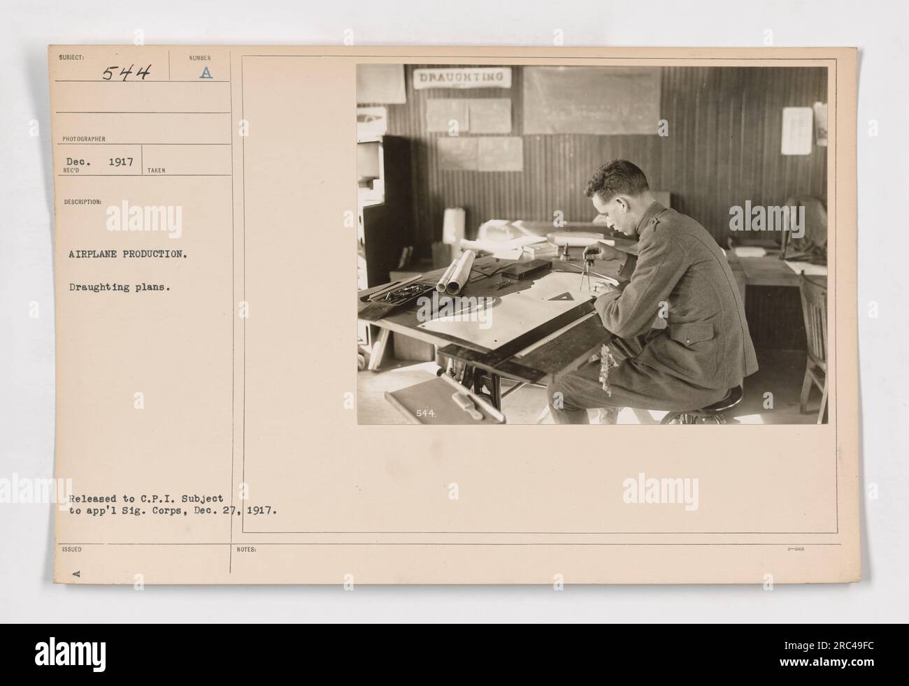 Men working on drafting plans for airplane construction during World ...