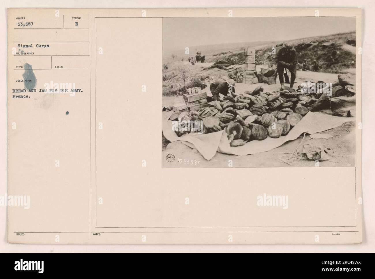 American soldiers receiving rations of bread and jam during World War ...