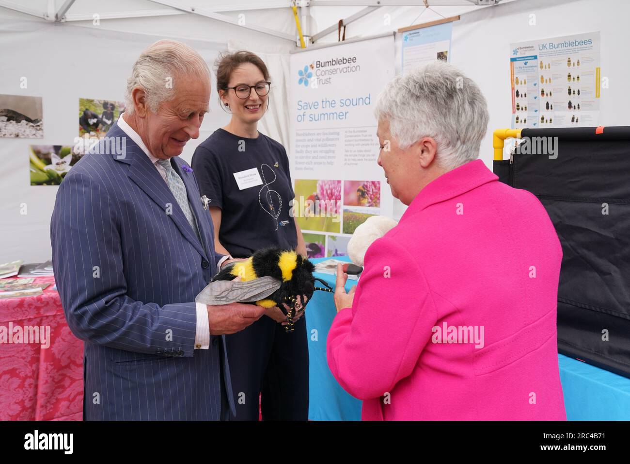 King Charles III is presented with a stuffed toy bumblebee by Gill ...