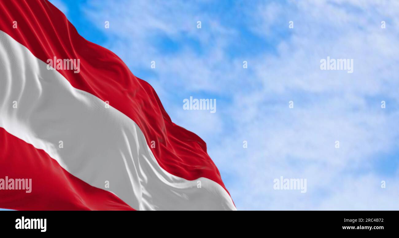 The national flag of Austria waving on a clear day. Three equal ...