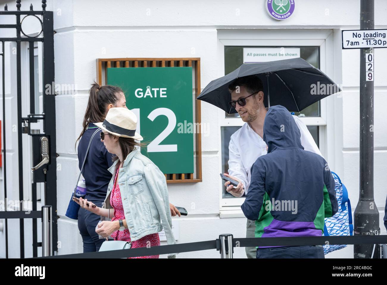London, UK. 12th July, 2023. UK weather; rain shower at Wimbledon ...