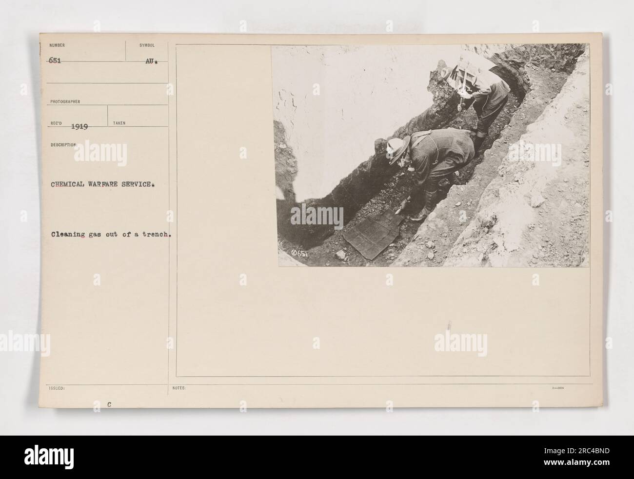 Soldiers of the Chemical Warfare Service cleaning out gas from a trench ...