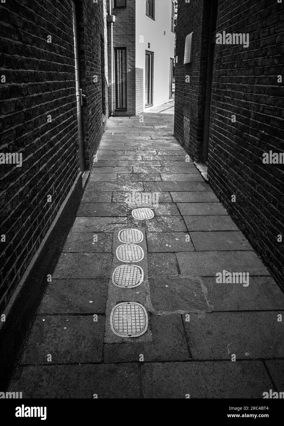 Drain covers Black and White Stock Photos & Images - Alamy