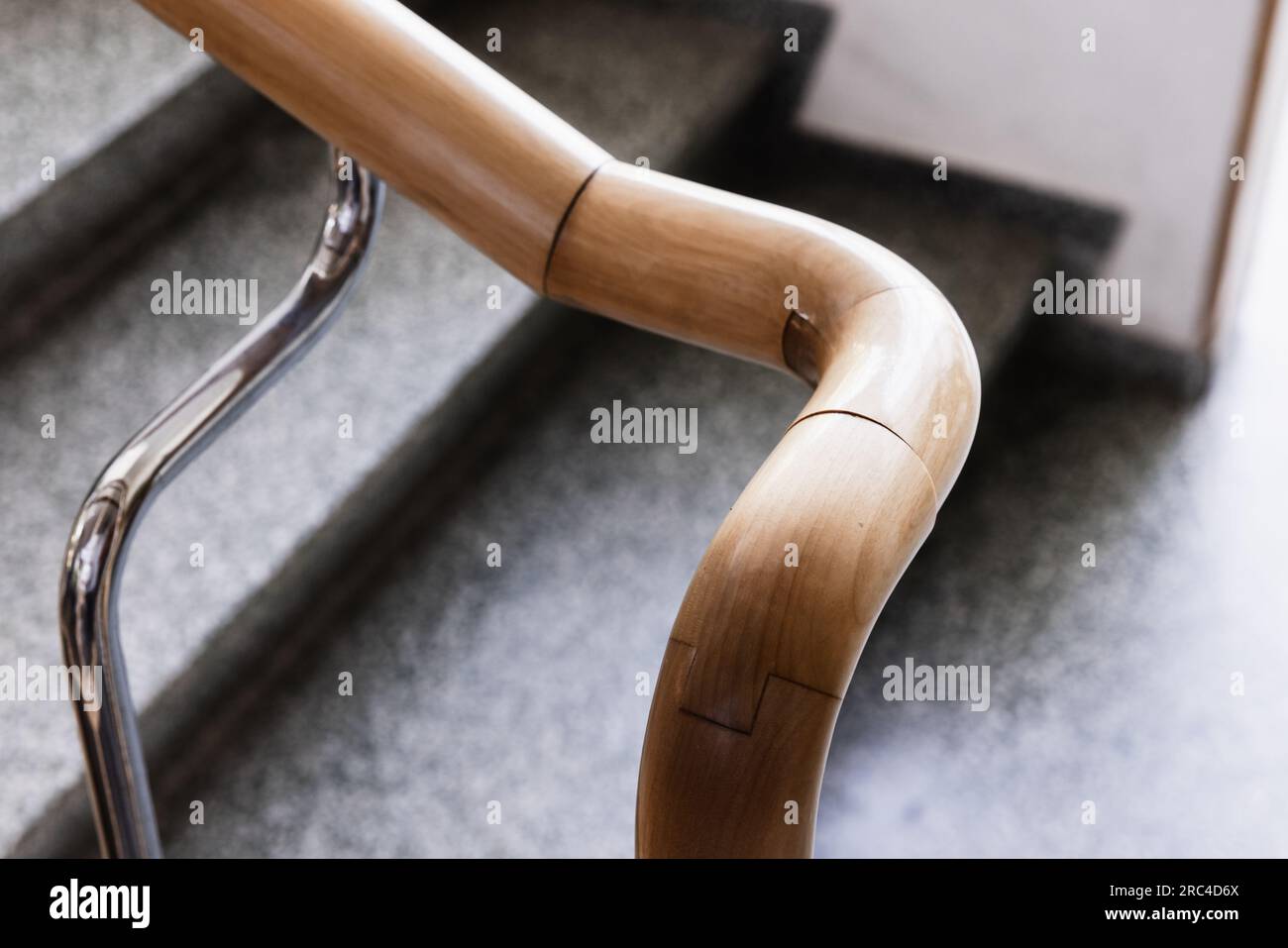 Abstract interior design, curved wooden handrail close-up photo with ...
