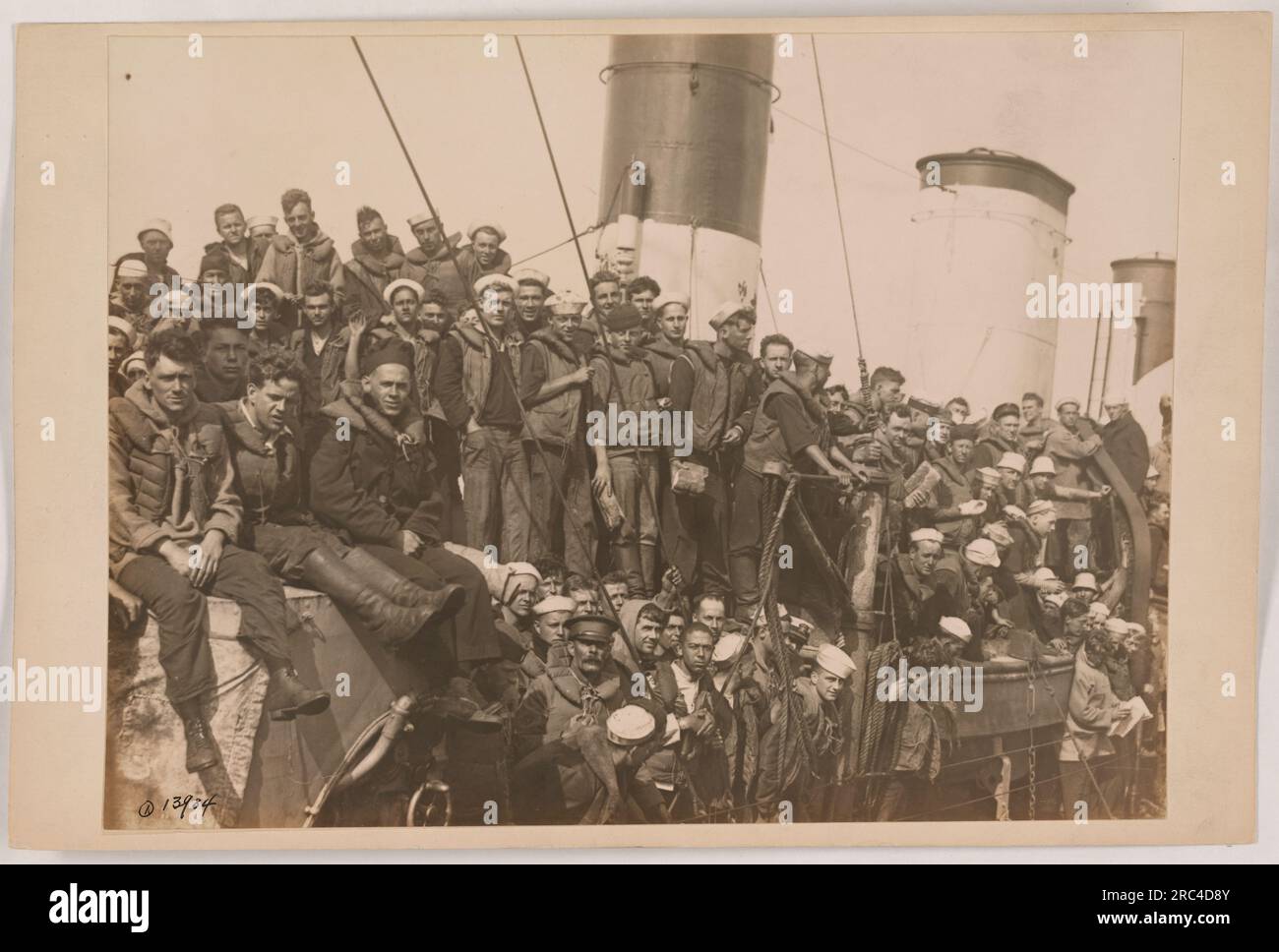 A group of American soldiers gathered around a table in a military base ...