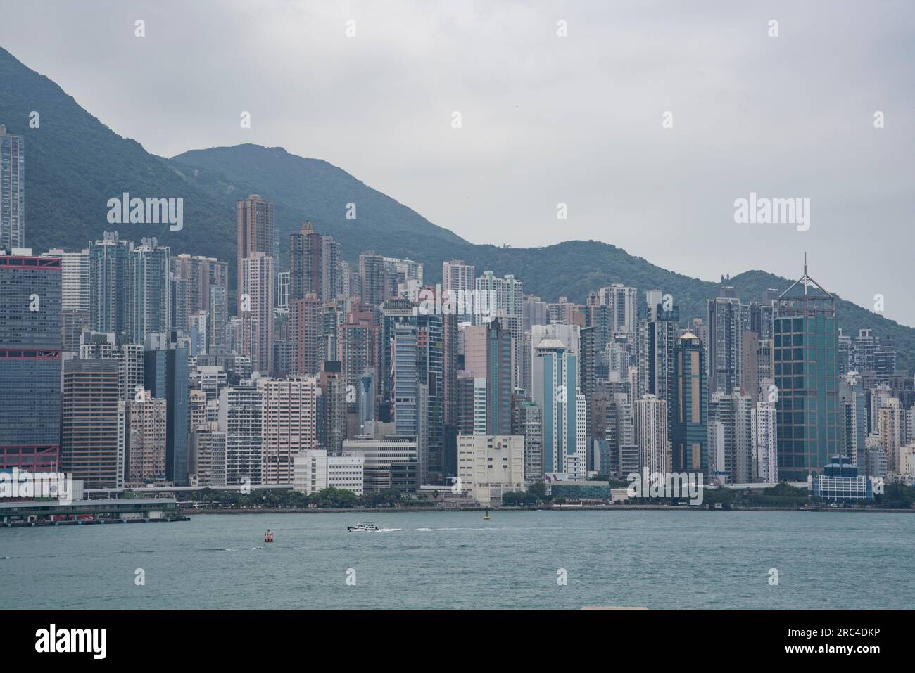 The tall financial center building and surrounding bustling buildings ...