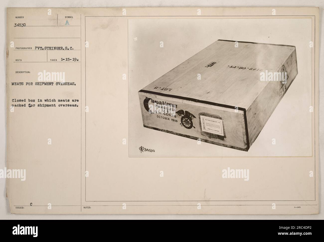 American soldiers preparing meats for shipment overseas during World ...