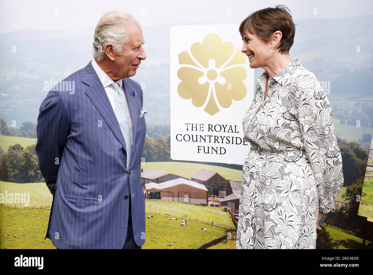 Britain's King Charles III, left, speaks with hill farmer Denise Cooper ...