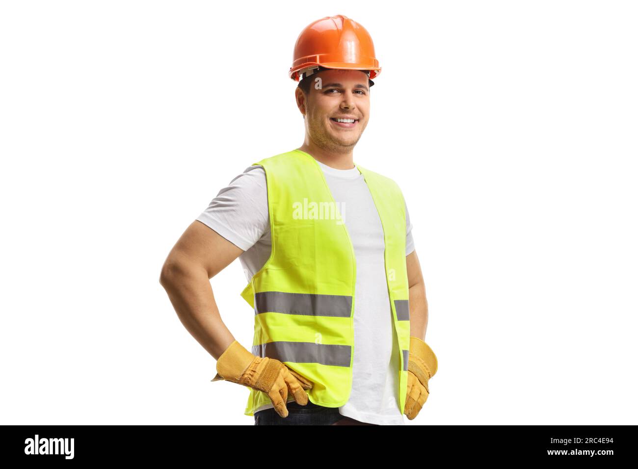 Construction worker with a helmet and a safety vest smiling at camera ...