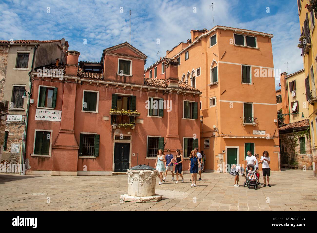 Touristic gondola in narrow grand canal between buildings in Venice ...