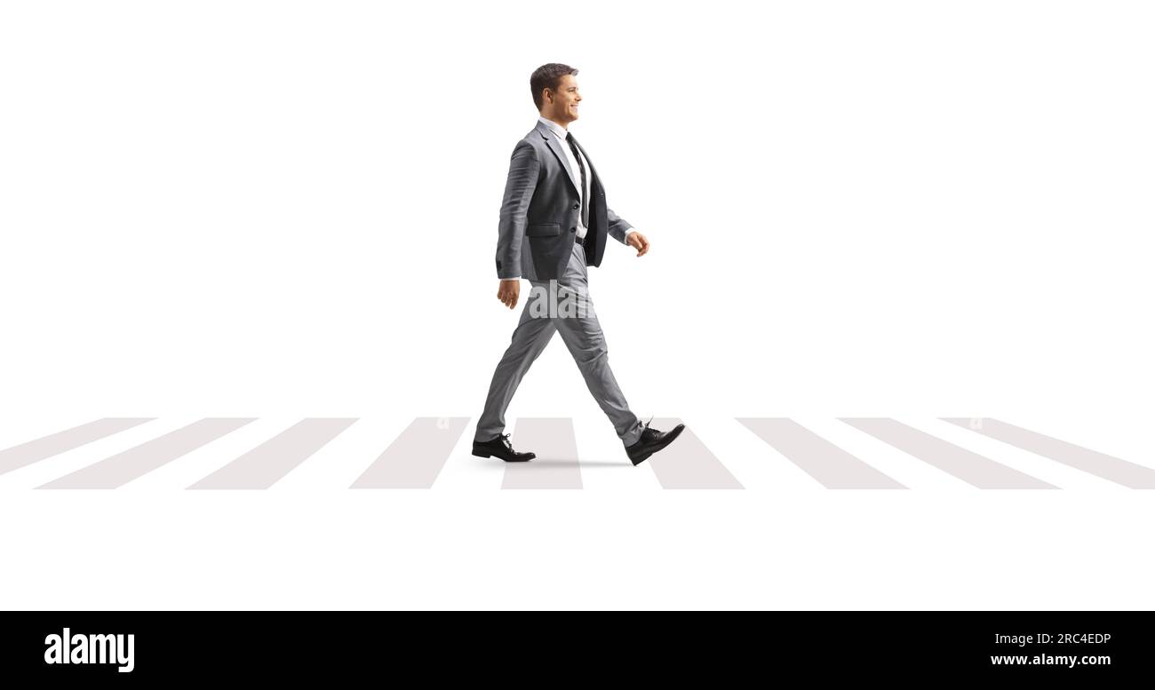 Full length profile shot of a professional man on a pedestrian crossing ...