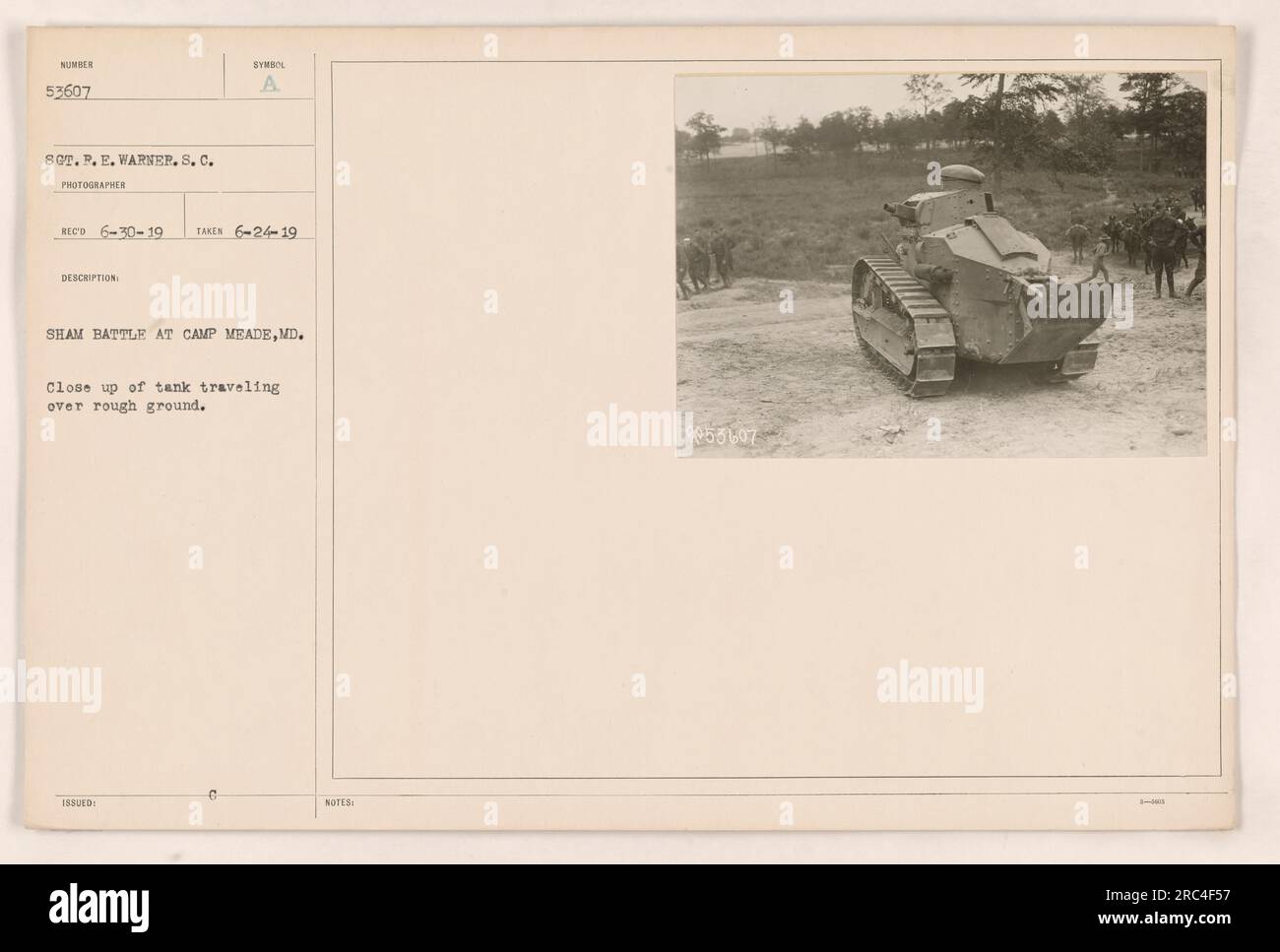 Tank maneuvering through rough terrain during a sham battle at Camp ...