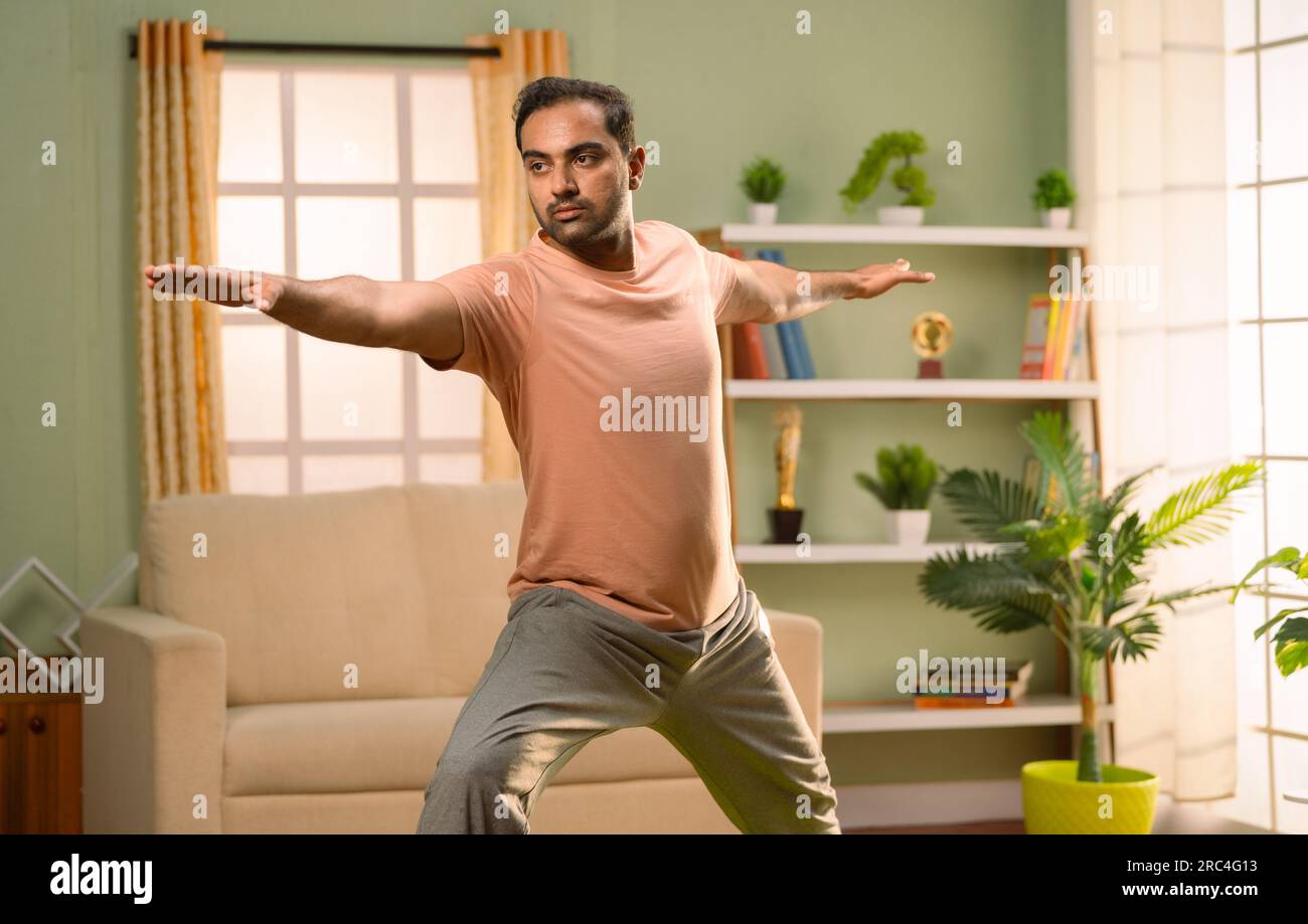 Indian man doing exercise stretching hi-res stock photography and ...
