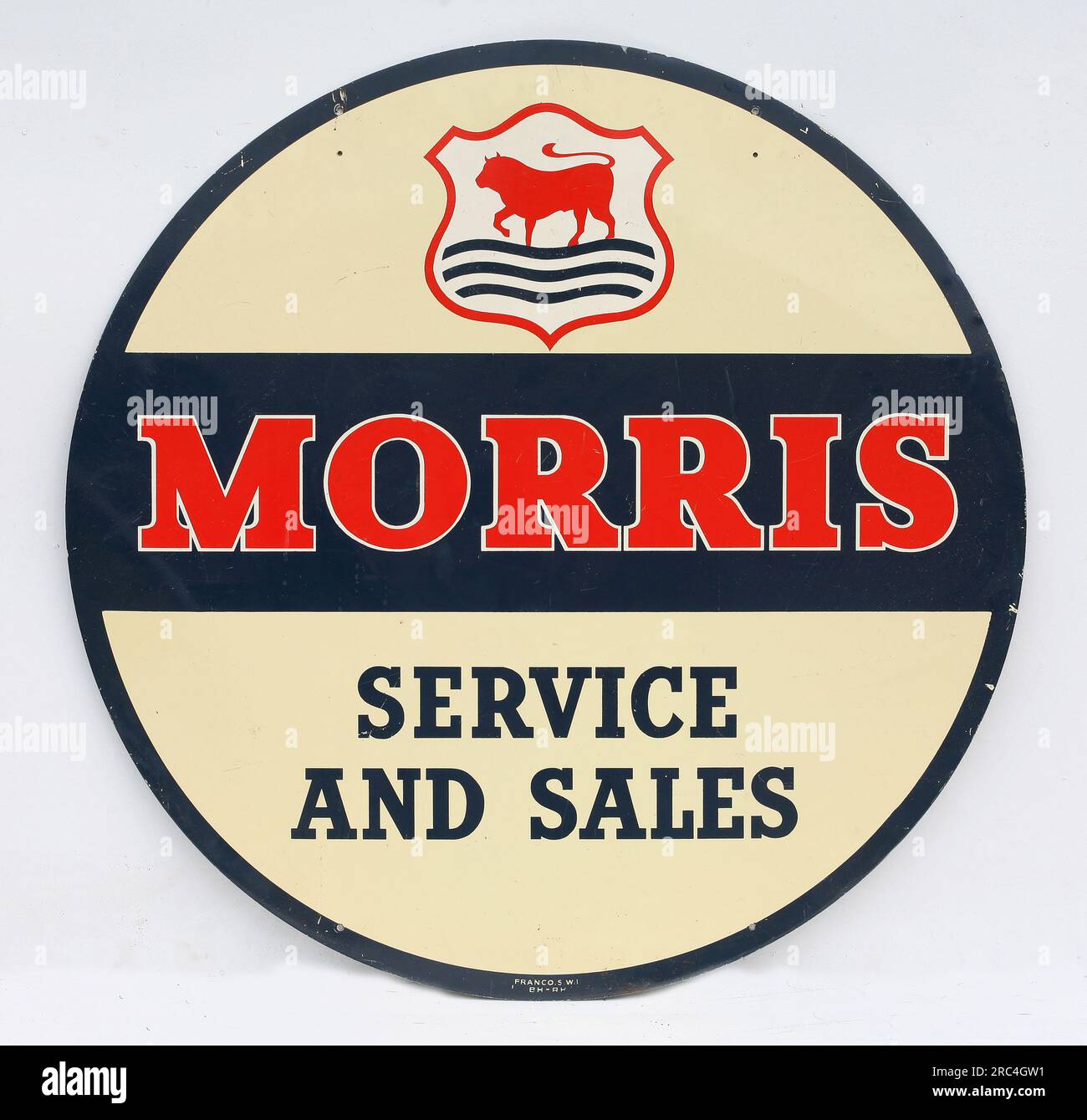 A round vintage enamel Morris garage sign Stock Photo - Alamy