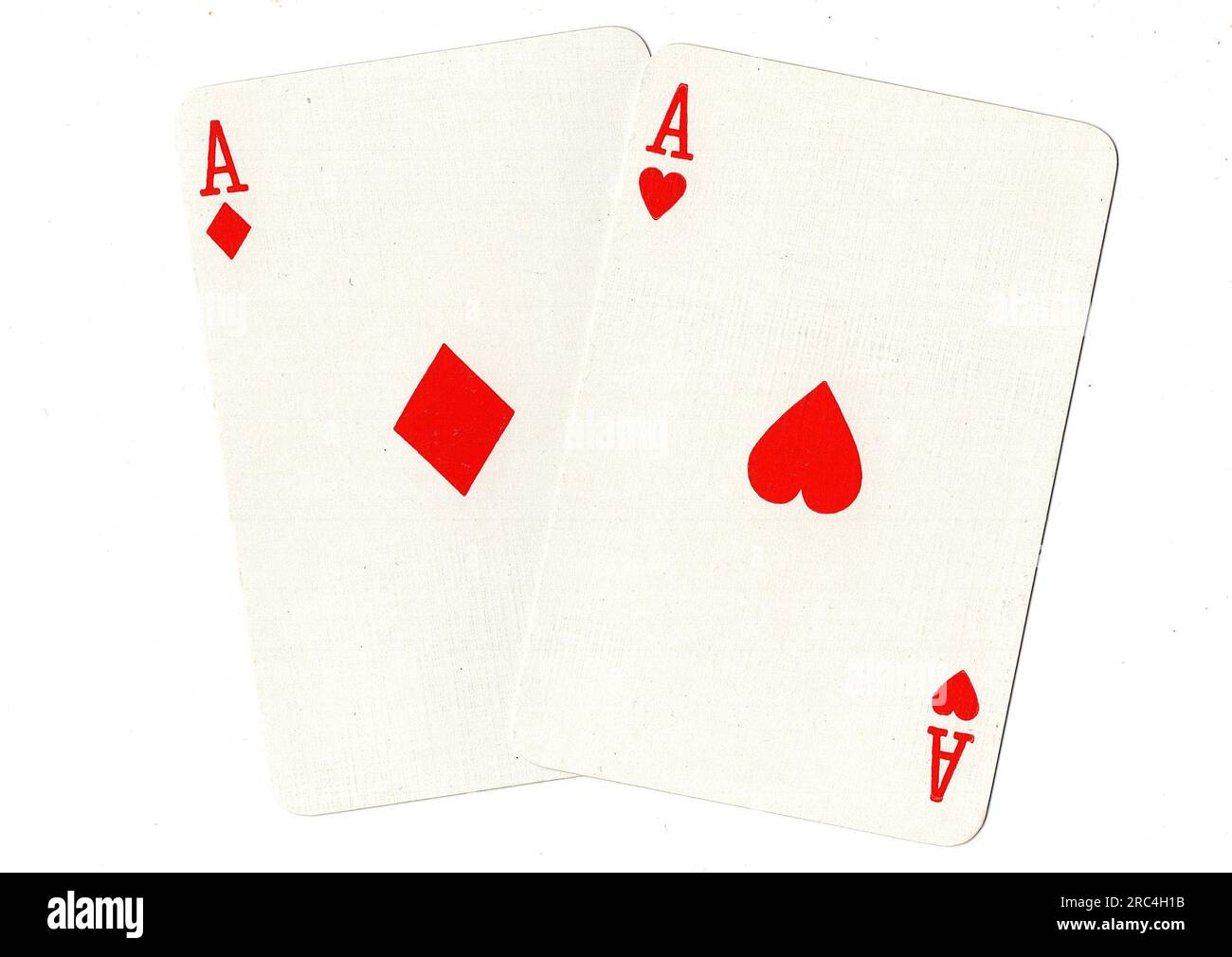 Vintage playing cards showing a pair of aces on a white background ...