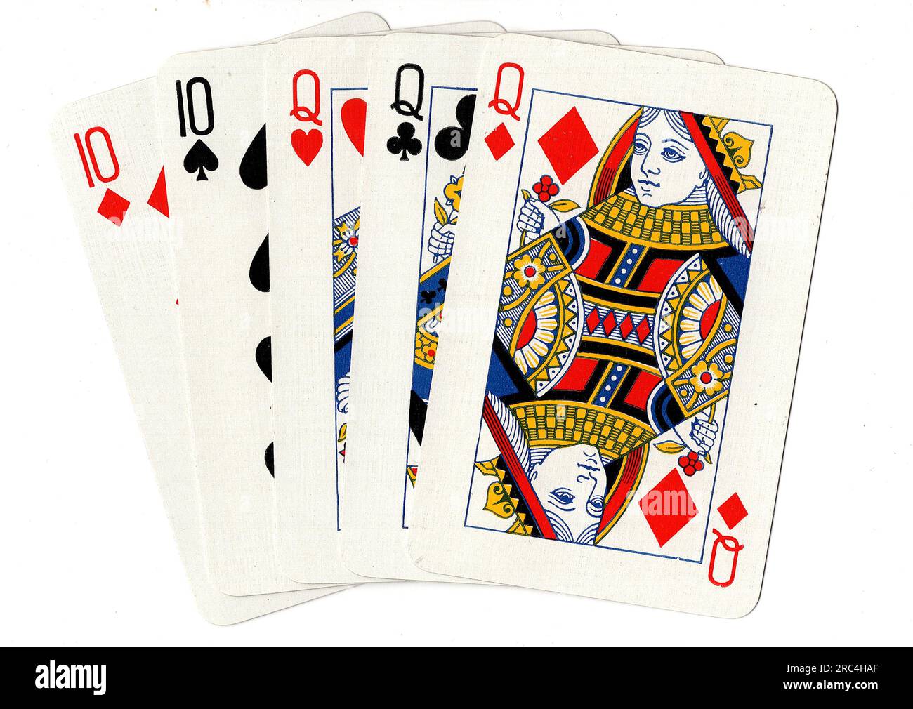 A poker hand of playing cards showing a full house of queens and tens ...