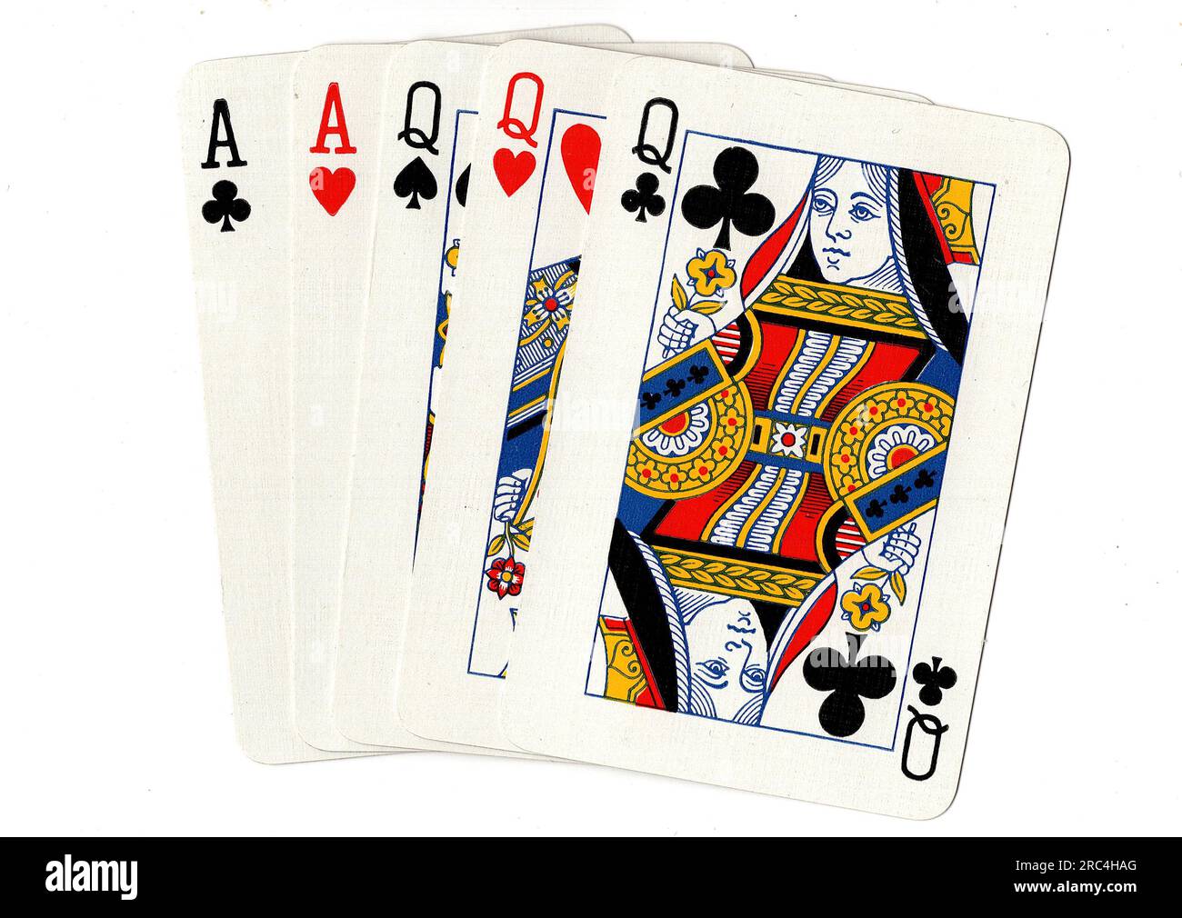 A poker hand of playing cards showing a full house of queens and aces ...