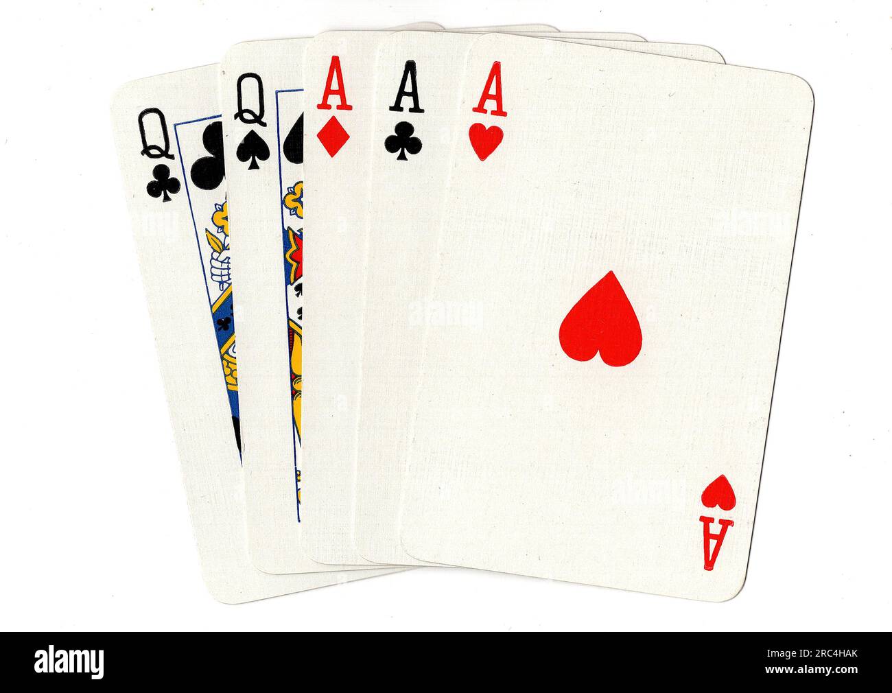 A poker hand of playing cards showing a full house of aces and queens ...