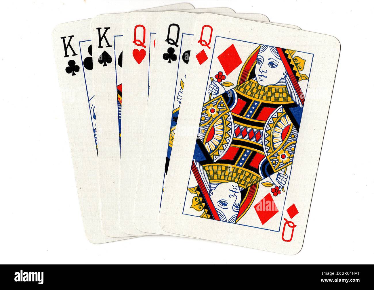 A poker hand of playing cards showing a full house of queens and kings ...