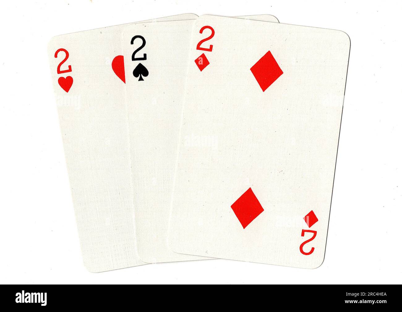 Vintage playing cards showing three twos on a white background Stock ...