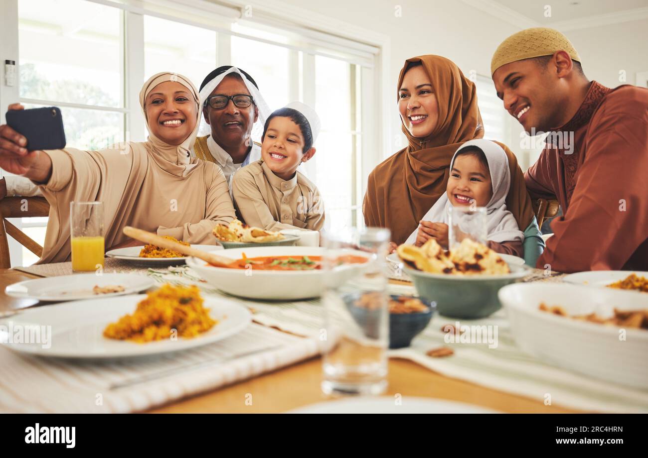 Food, selfie and muslim with big family at table for eid mubarak ...