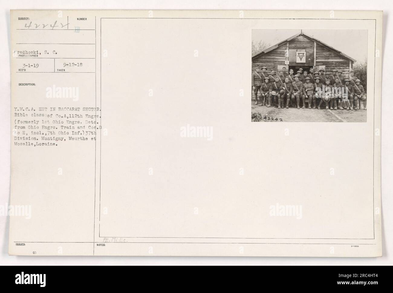 Image shows soldiers engaged in a Bible class at a Y.M.C.A. hut in the ...