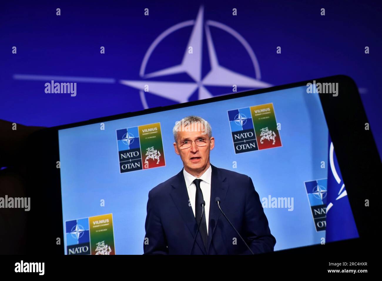 Viewing on a phone a live broadcast of Jens Stoltenberg's speech ...