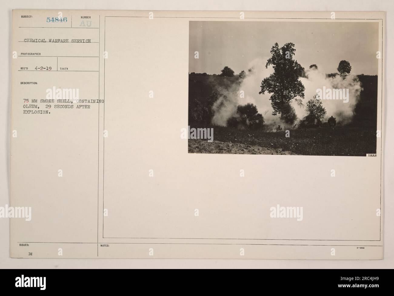 Image of a 75mm smoke shell exploding, taken by a photographer from the ...