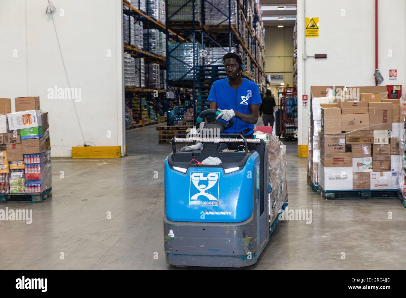 worker on the forklift that loads and distributes the food for the ...