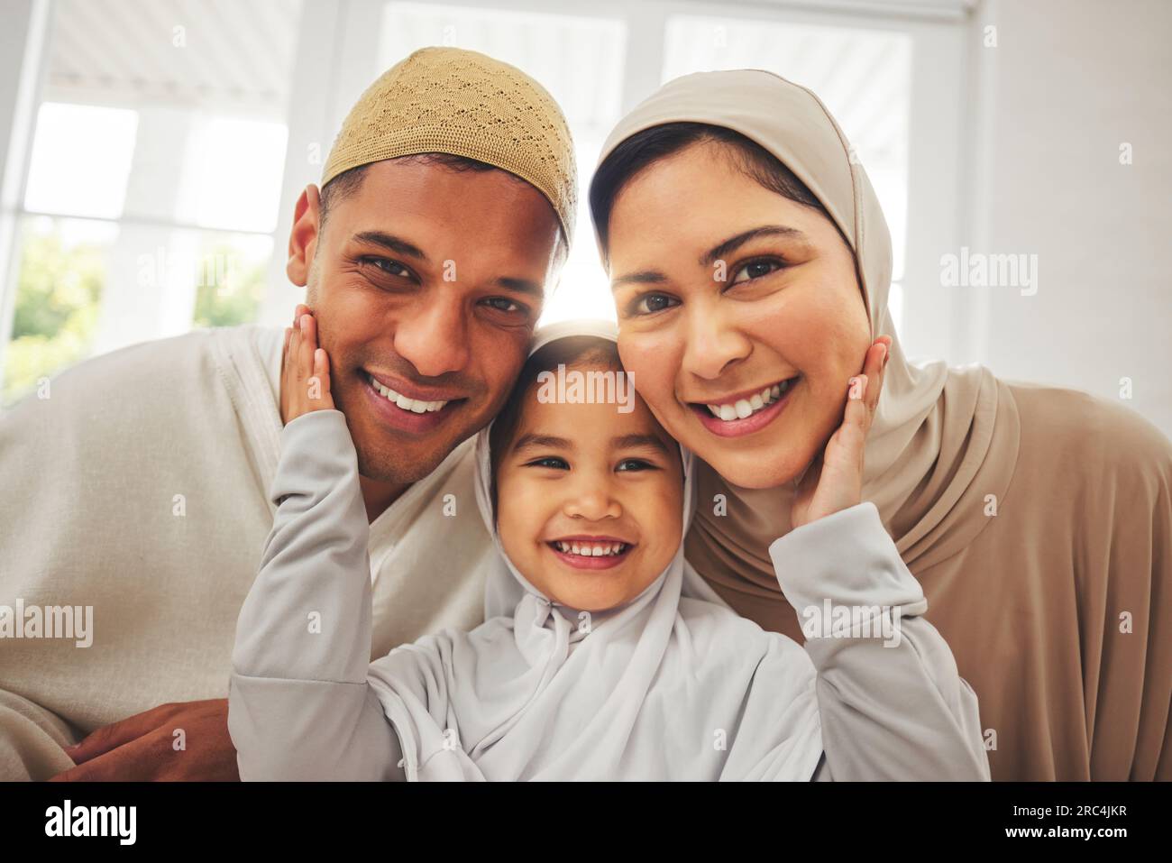 Islam, portrait and smile, parents and kid in living room for Eid with ...