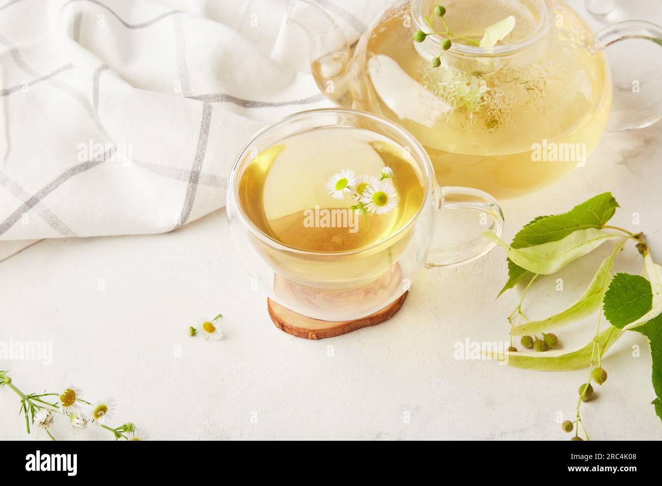 Healthy natural organic linden and chamomile tea blossoms. Summer table ...