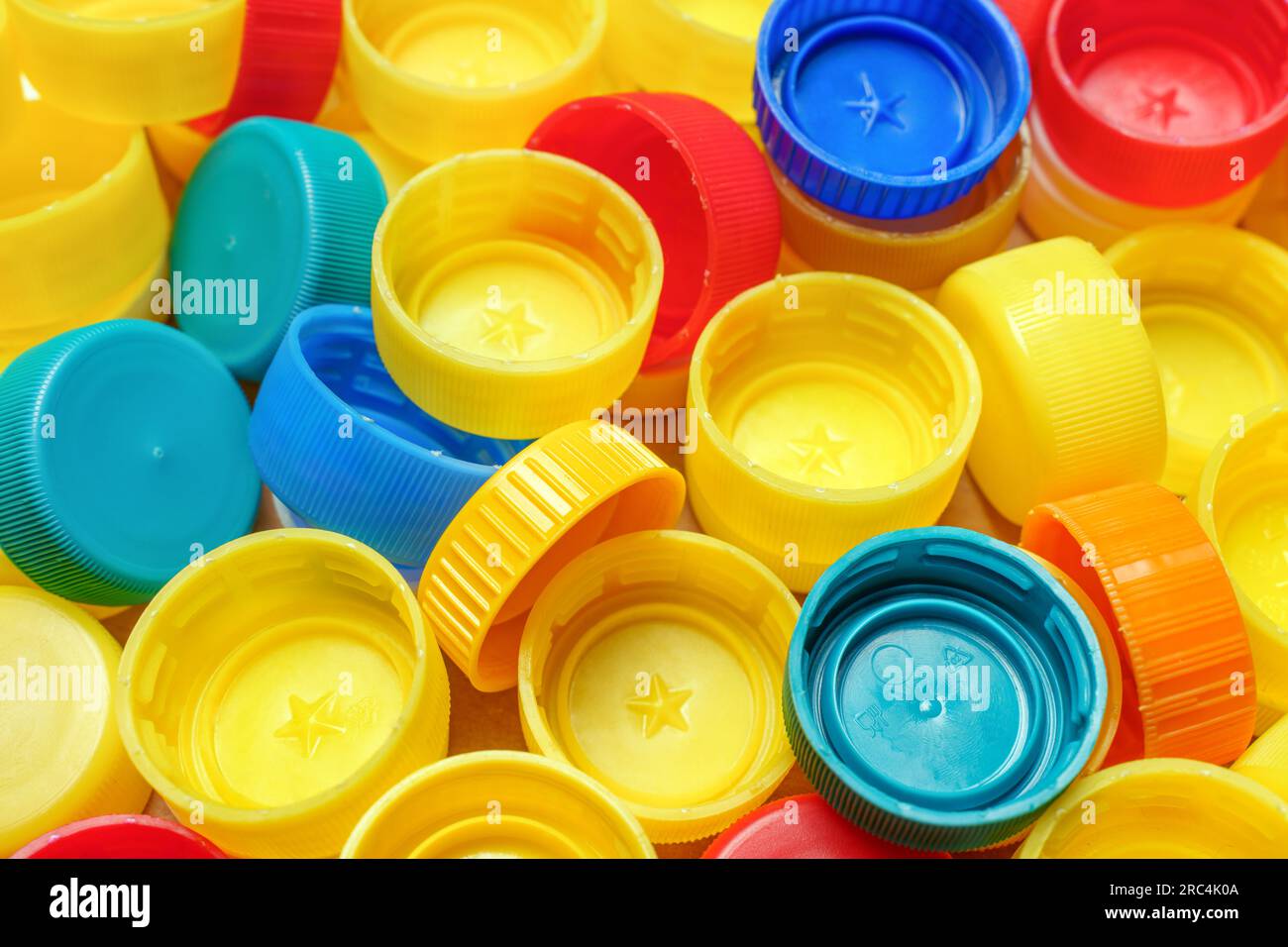 Pile of colorful bottle caps background. Used PET recycling plastic ...