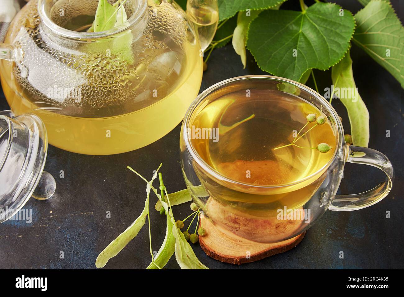 Cup of healthy natural linden, chamomile tea blossoms. Natural relaxing ...