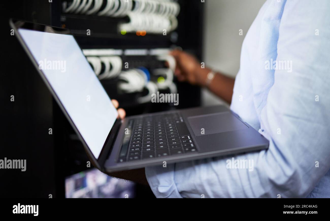 Server room, laptop and IT technician man with internet connection for ...