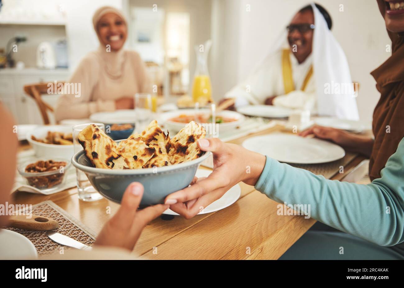 Food, celebration and muslim with big family at table for eid mubarak ...