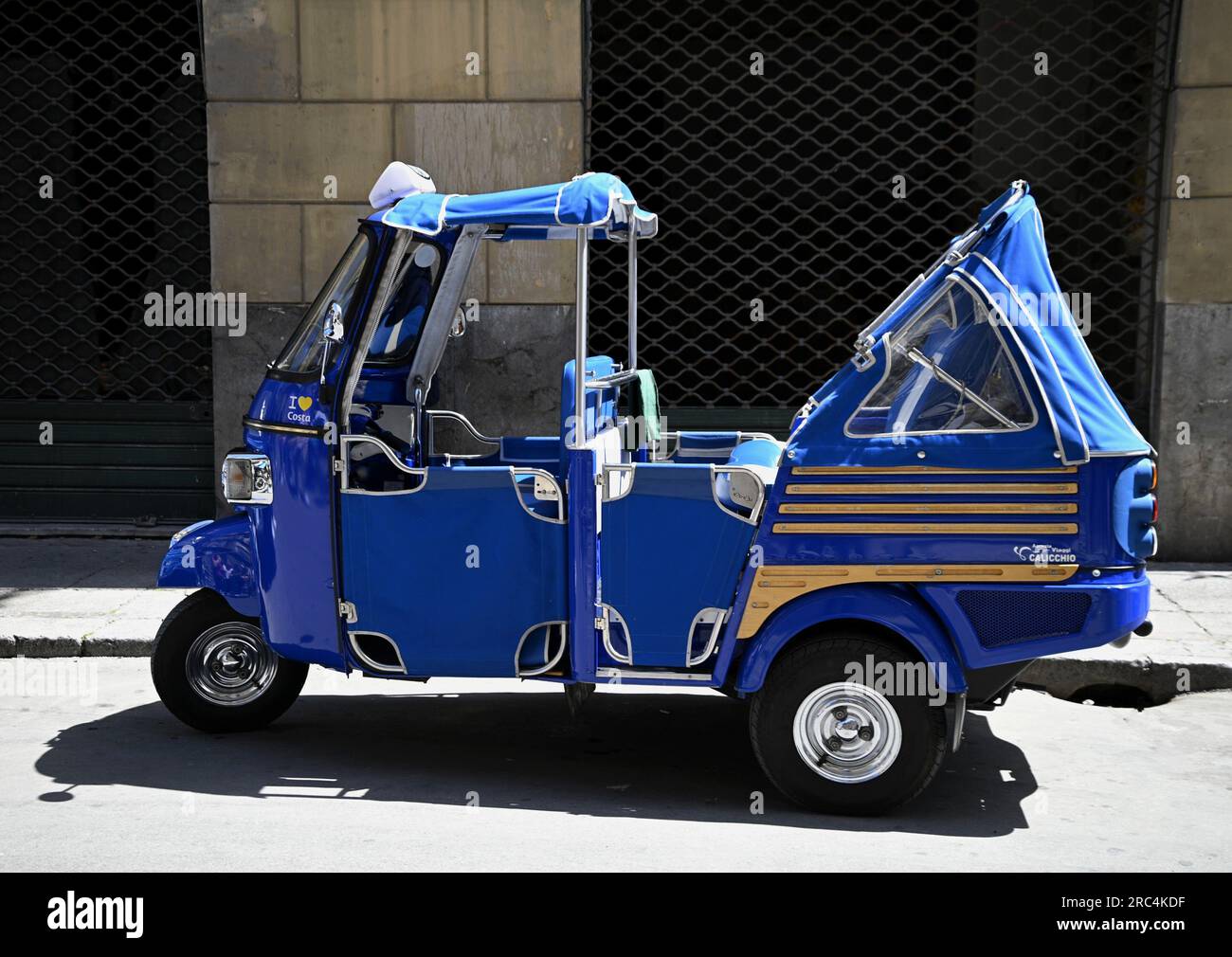 Vintage traditional three wheeled Piaggio Ape taxi on the streets of ...
