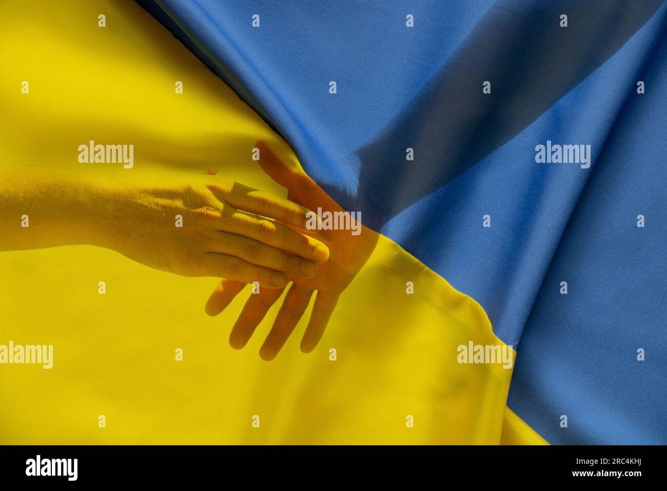 Two men extended their hands to each other as a sign of friendship and ...