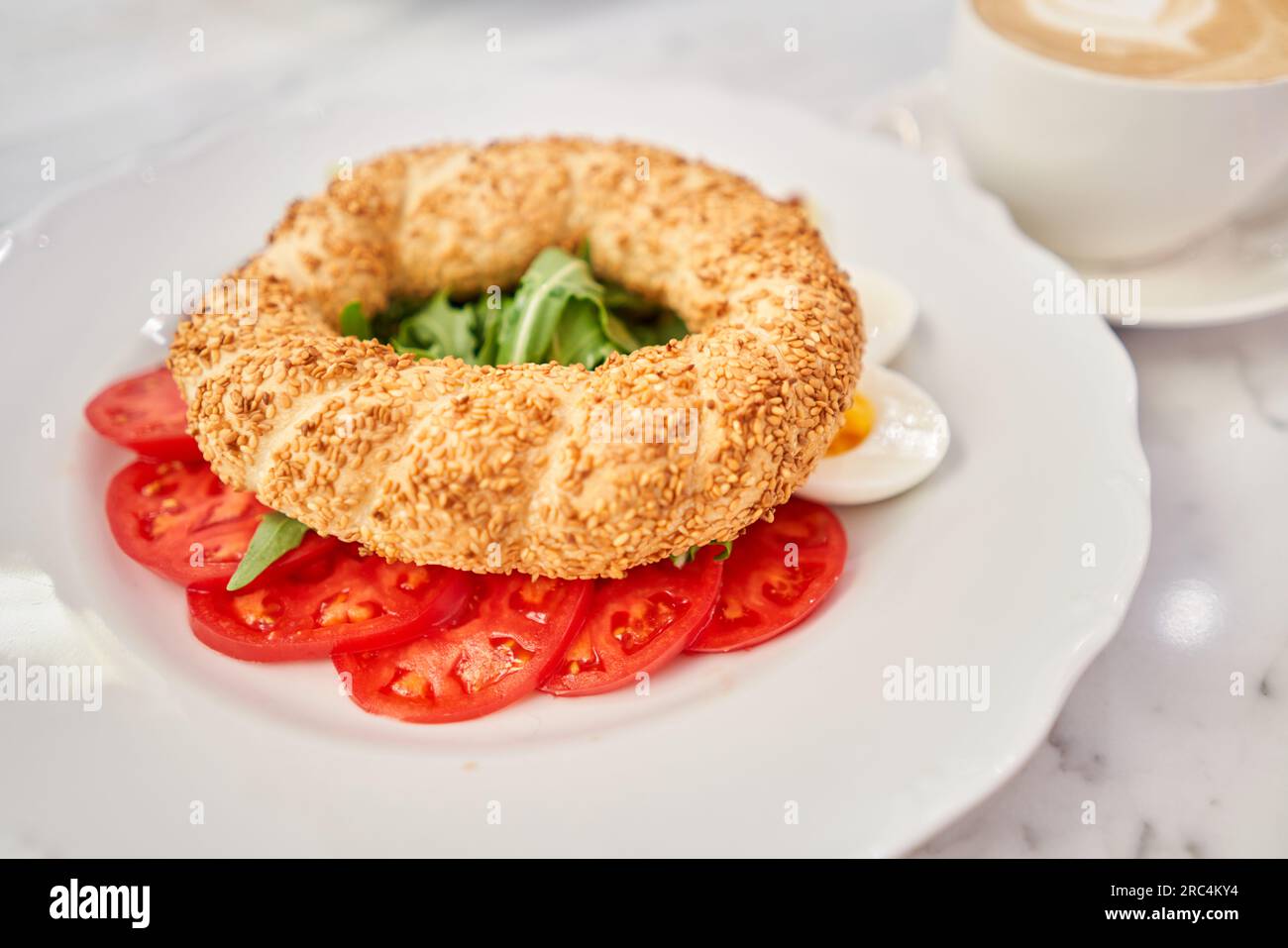 Turkish breakfast with simit, cheese, tomato, cucumber, olives ...