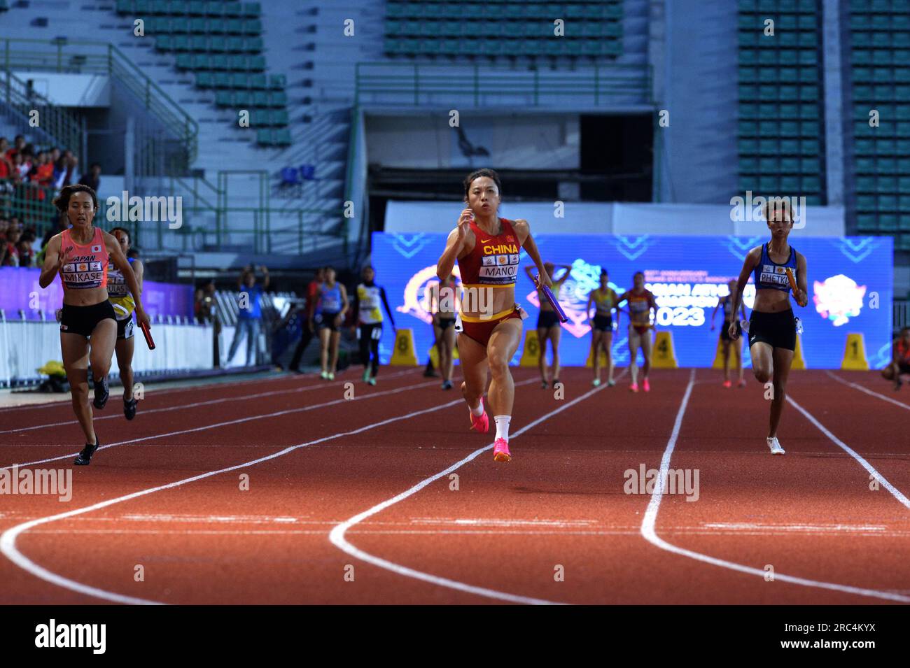 Bangkok, Thailand. 12th July, 2023. Ge Manqi (front) of China sprints during the women's 4X100 ...