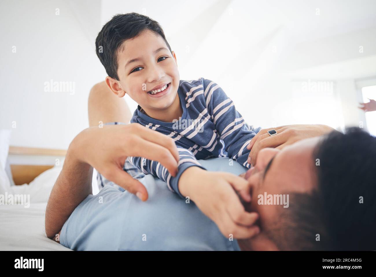 Family, boy portrait and hug with fun and smile in a home with bonding ...